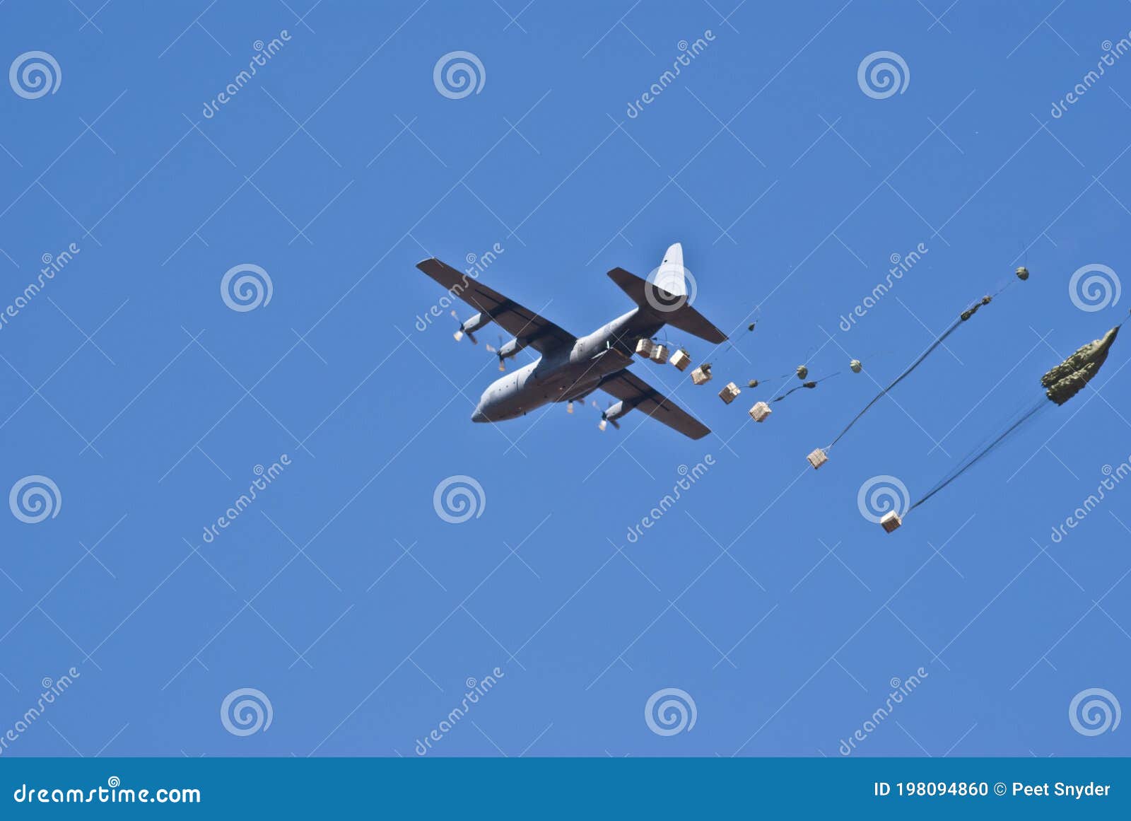 Cargo Plane Dropping Supplies Stock Photo - Image of perspective, boxes ...