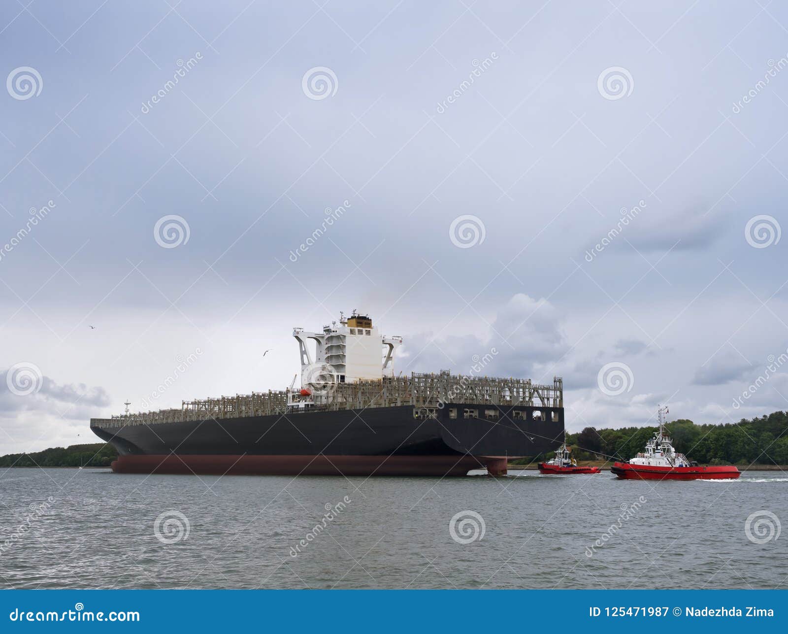 Cargo Ship with Escort, Empty Container Ship Stock Image - Image of ...
