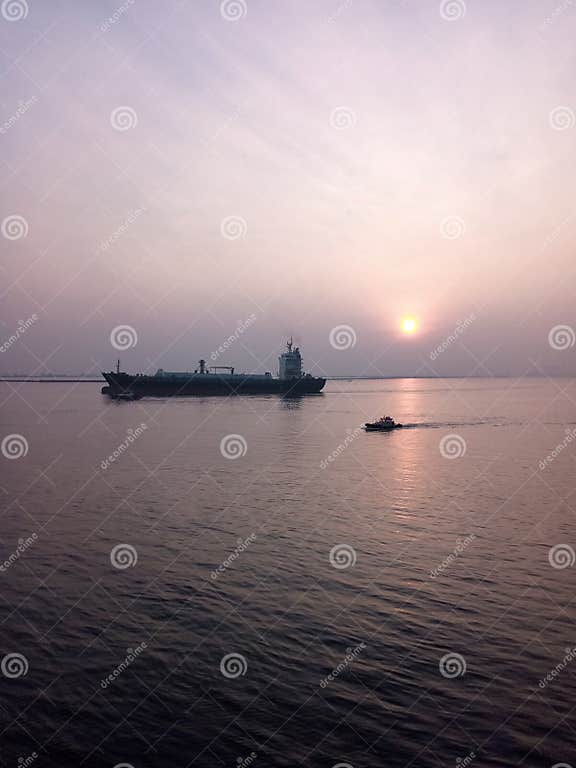 The Cargo Ship is Greeted by the Rising Sun Stock Image - Image of ship ...