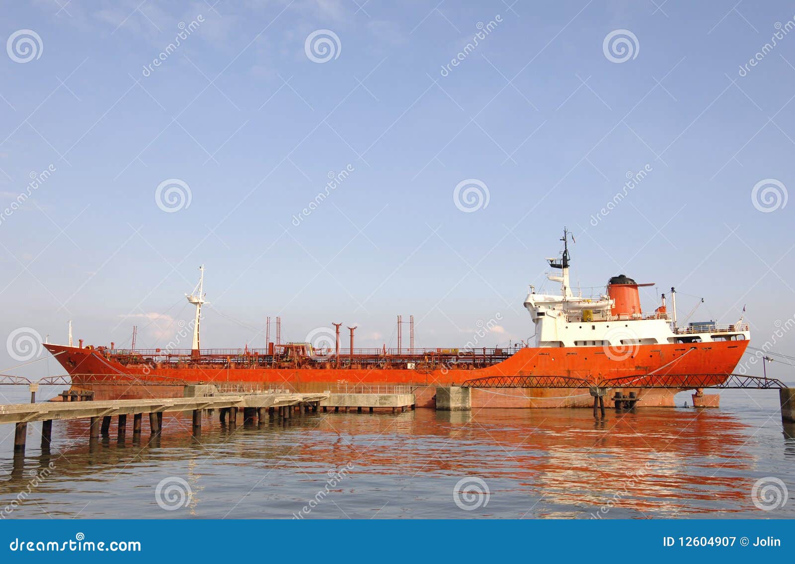 Cargo ship in a harbor stock image. Image of discharge - 12604907