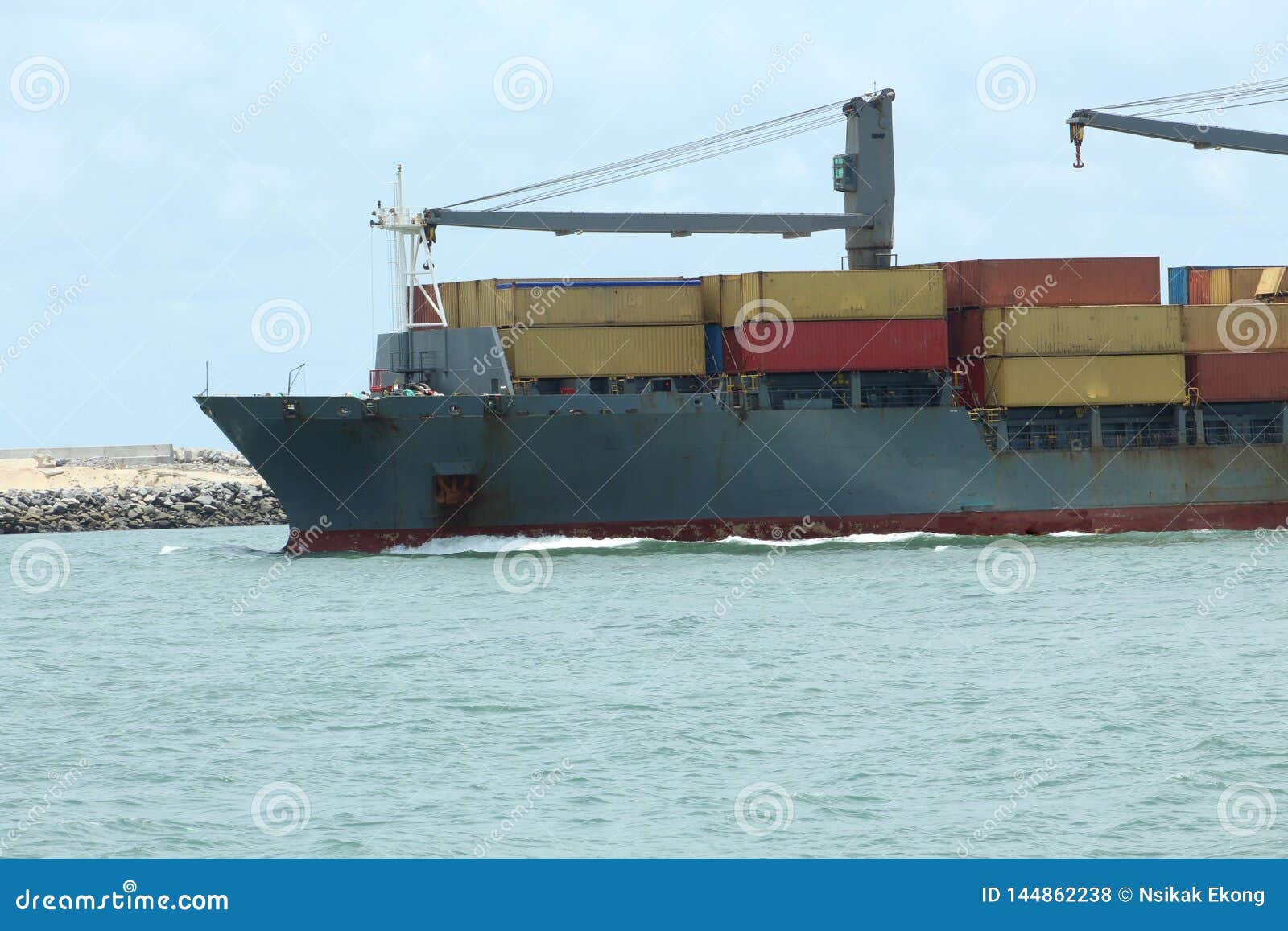 Cargo Ship Loaded with Containers in Sailing in an Inlet. Stock Photo ...