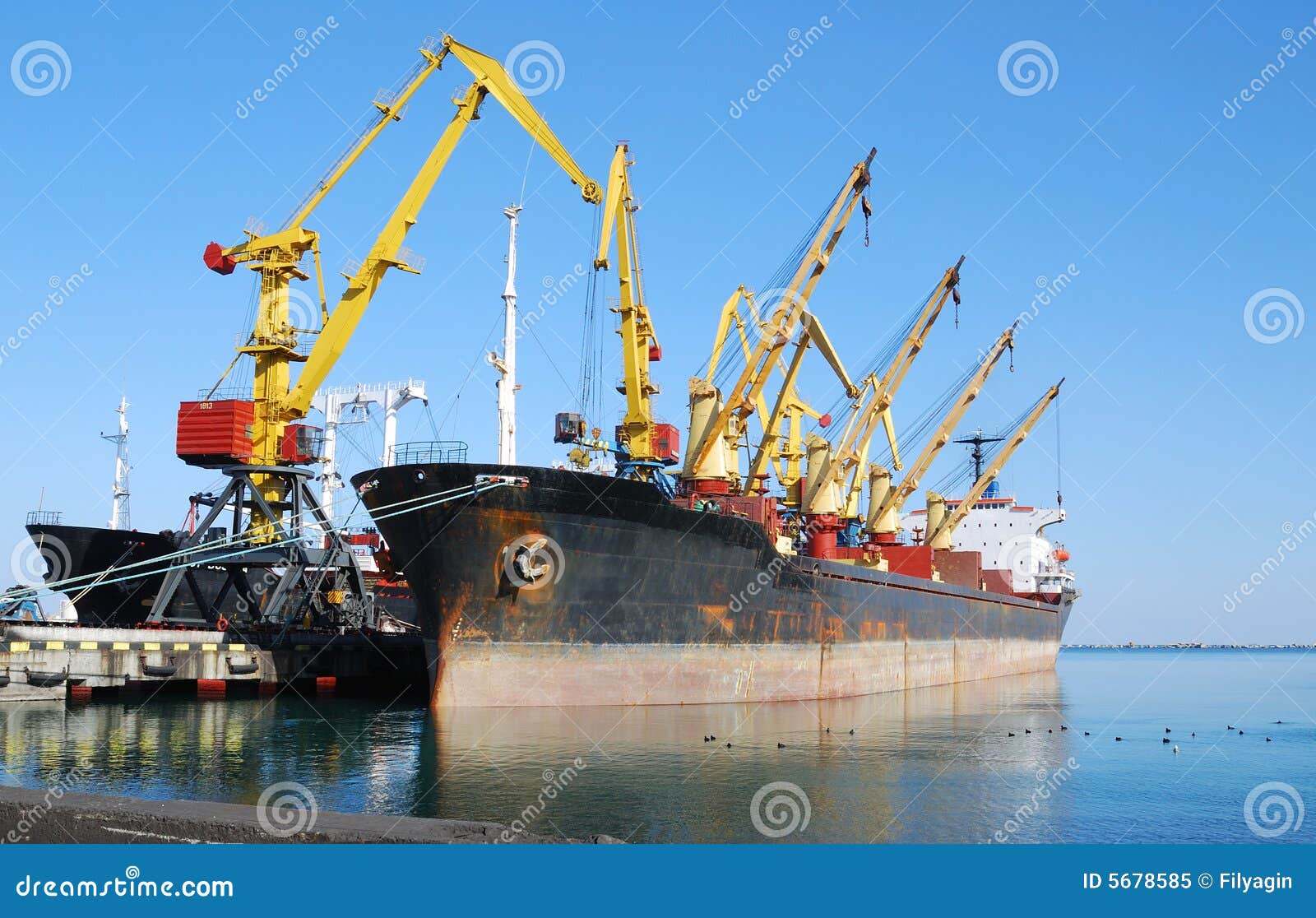Cargo ship on loading stock image. Image of cargo, dock - 5678585