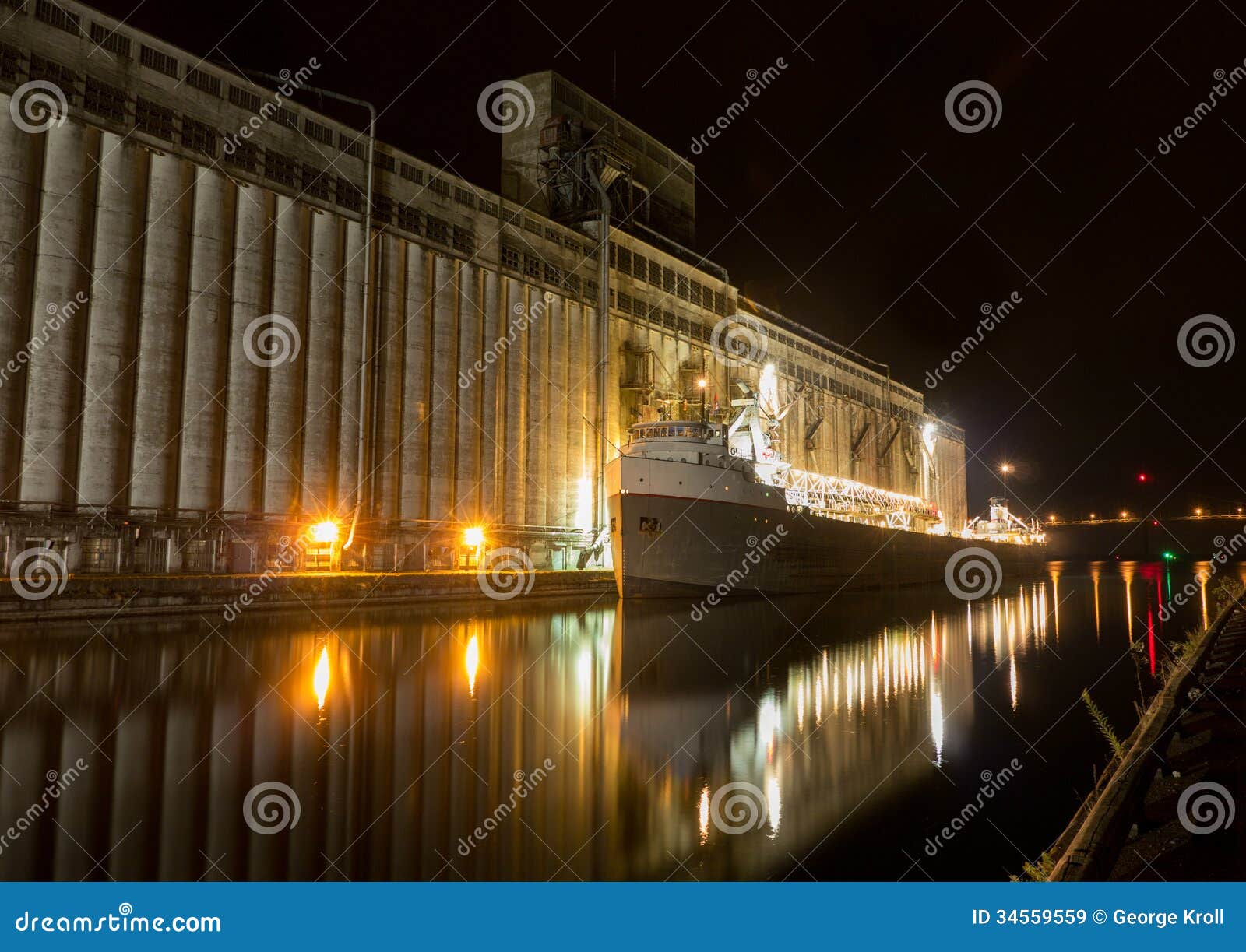 Cargo ship at night stock image. Image of shipload, landing - 34559559