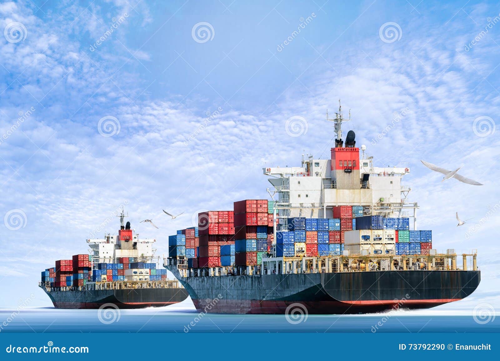 Cargo Ship in the Ocean with Birds Flying in Blue Sky Stock Photo ...