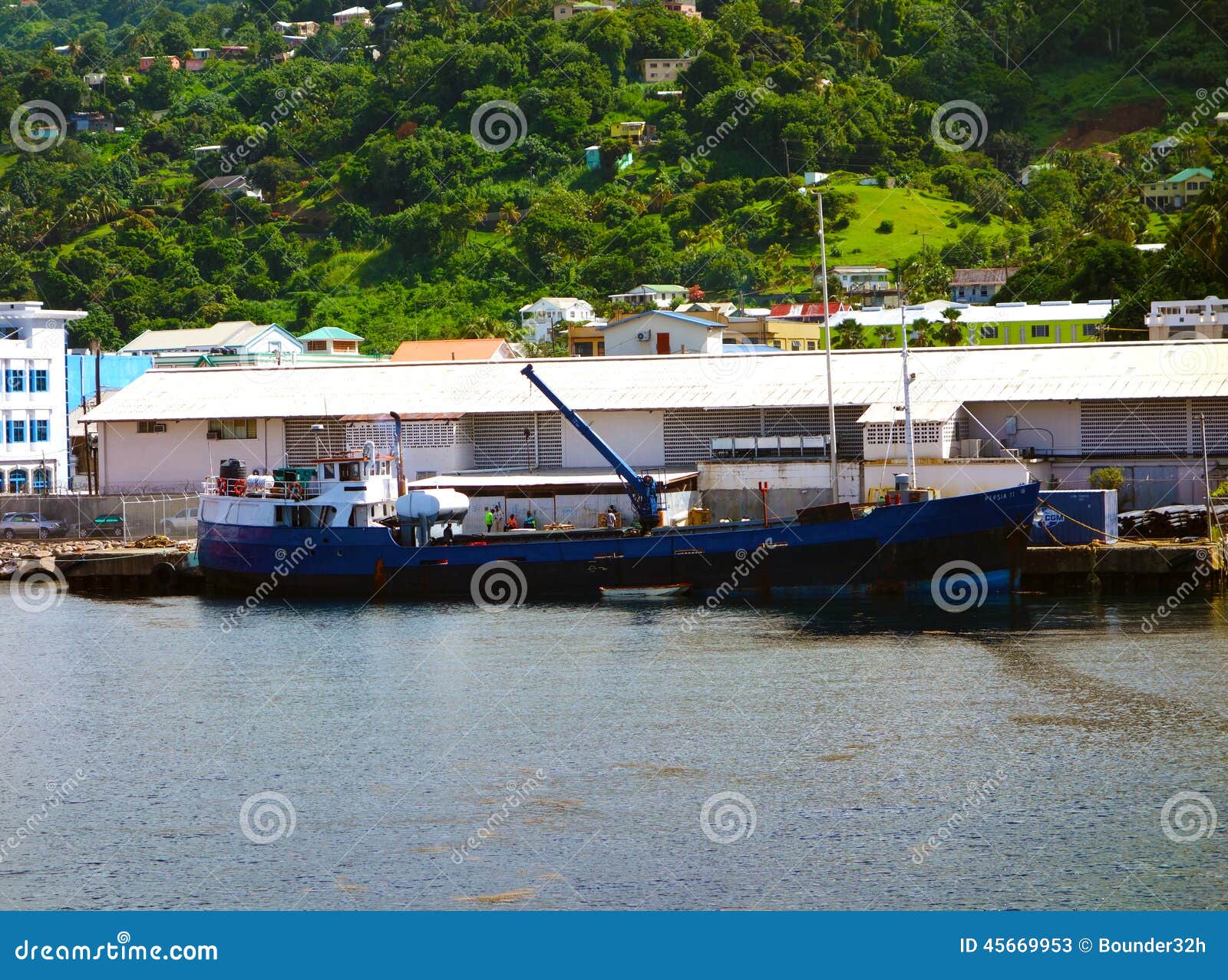 A Cargo Ship Off-loading at Kingstown Harbor Editorial Stock Photo ...
