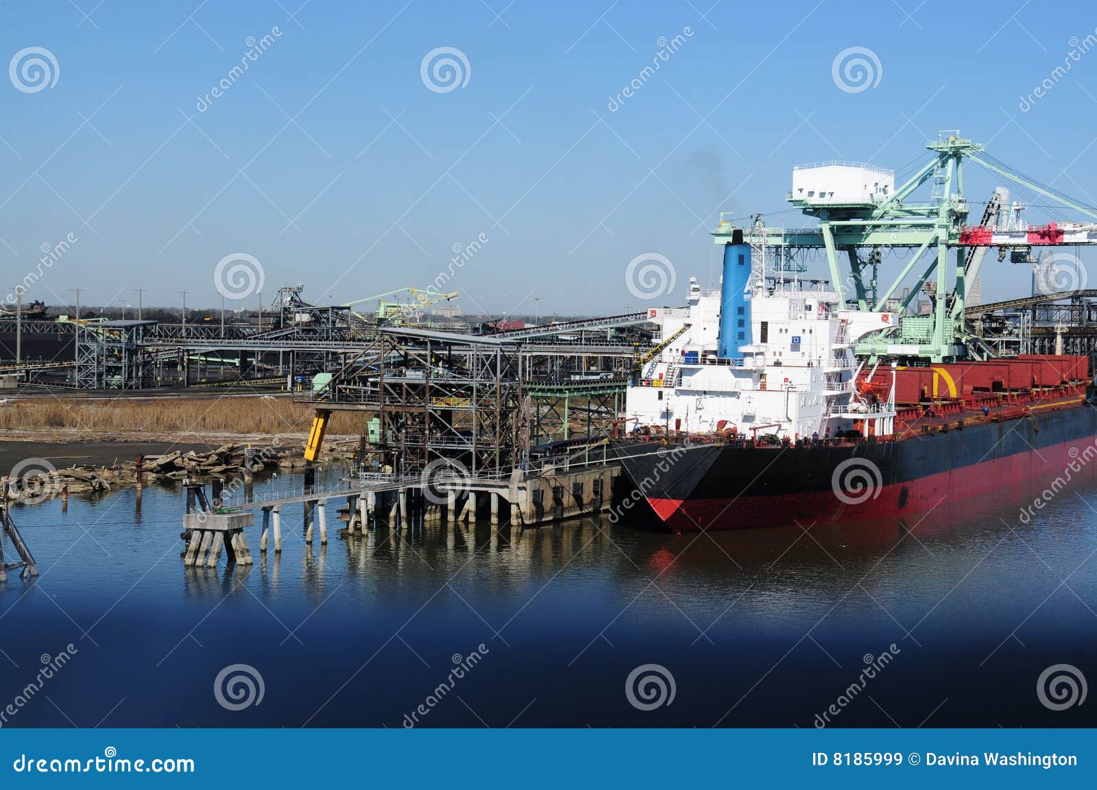 Cargo ship at oil refinery stock image. Image of heavy - 8185999