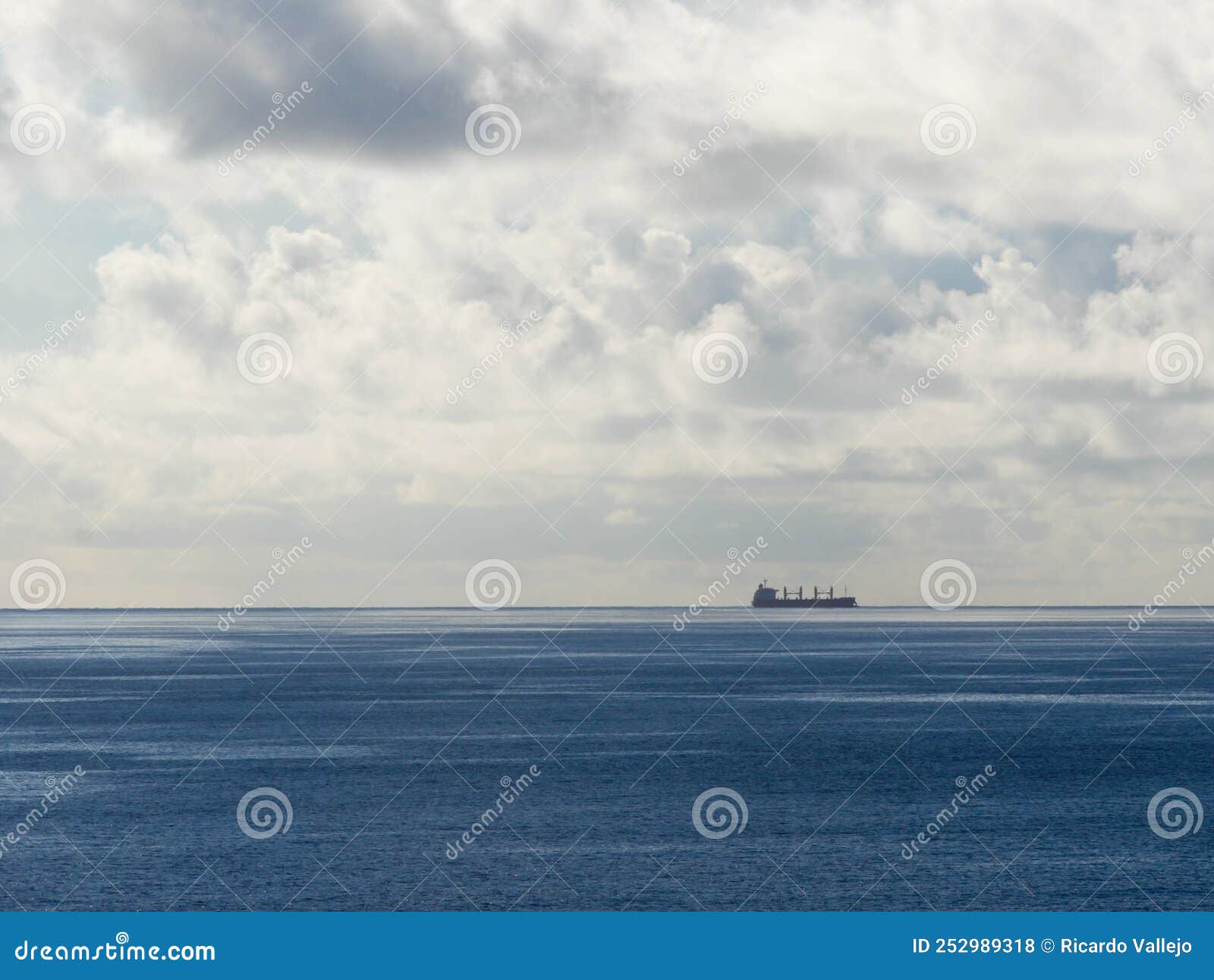 Cargo Ship Over the Horizon Stock Photo - Image of horizon, tranquil ...