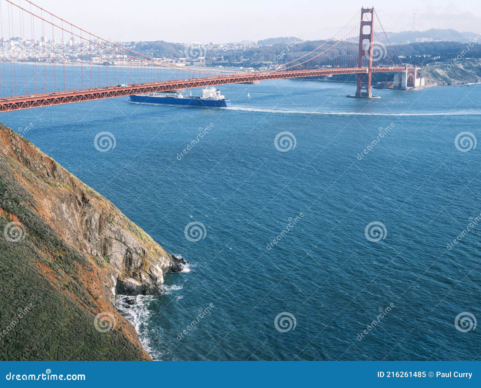 Cargo Ship Passing Under the Golden Gate Bridge Stock Image - Image of ...