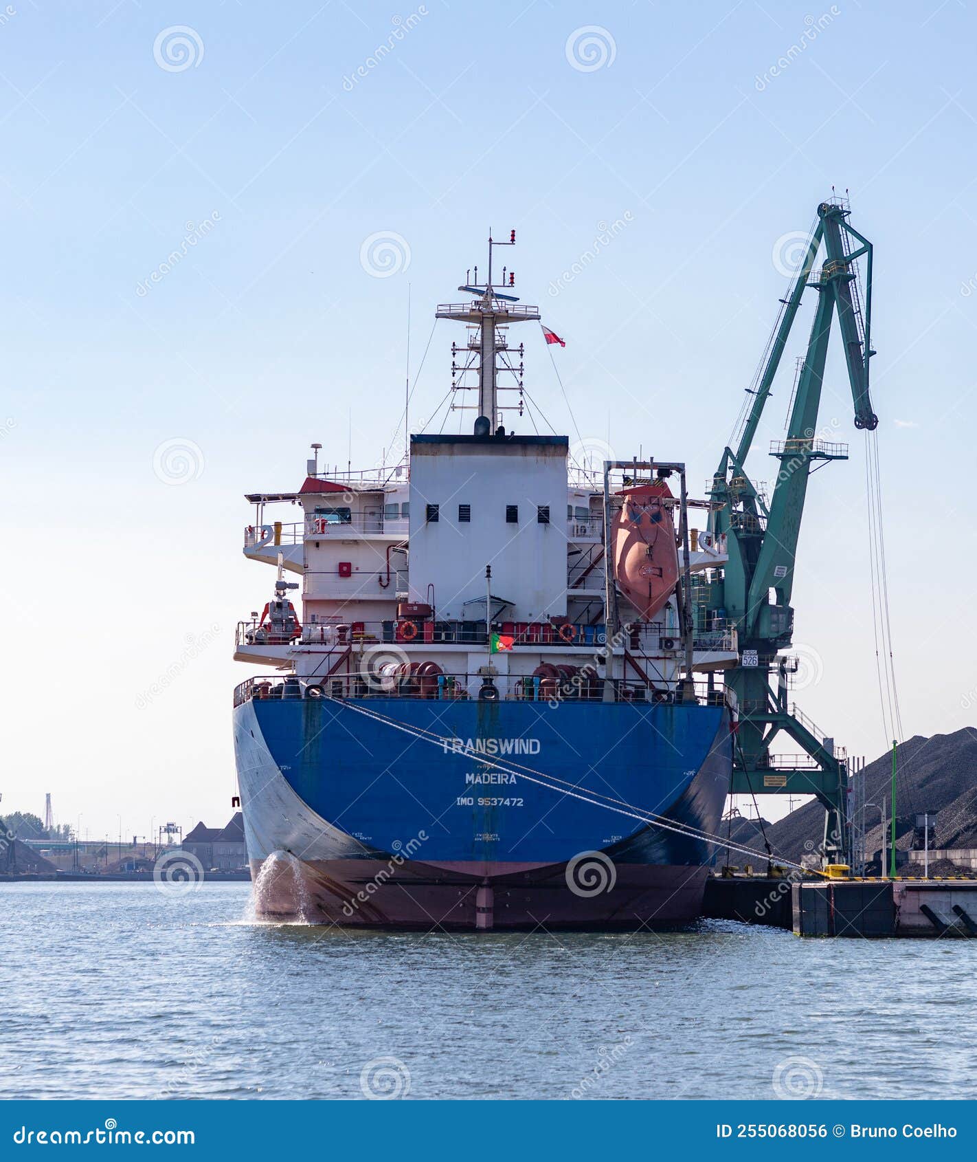 Stern Of Cargo Vessel At Port. Gangway Arrangment. Blue Hull. White ...