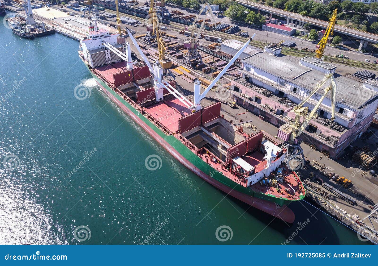 A Cargo Ship at the Pier in the Port. the Loading Process is in ...