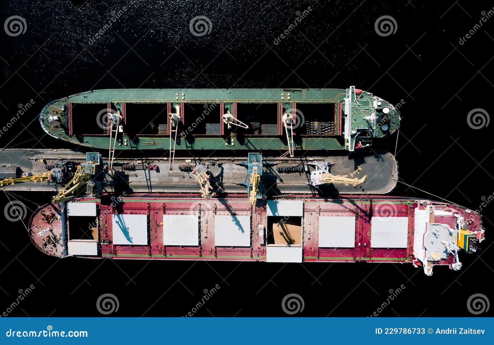 A Cargo Ship at the Pier in the Port. the Loading Process is in ...