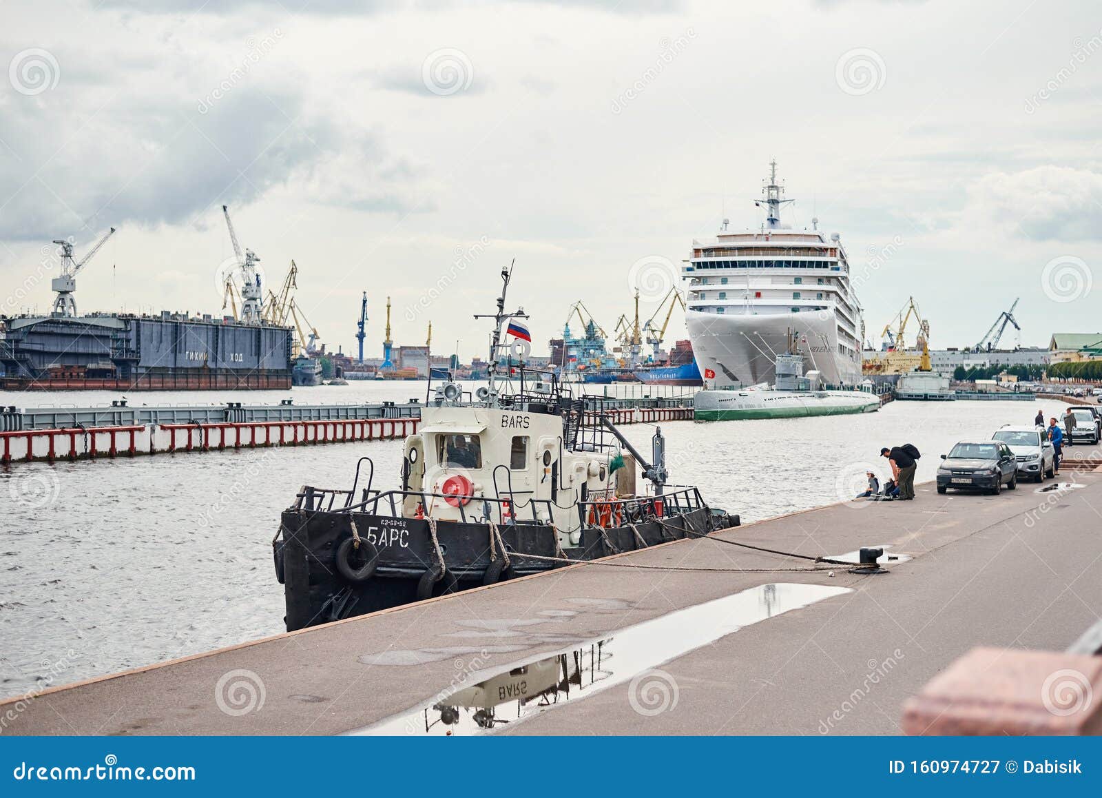 Cargo Ship in a Port Against Working Crane Bridge Editorial Photography ...