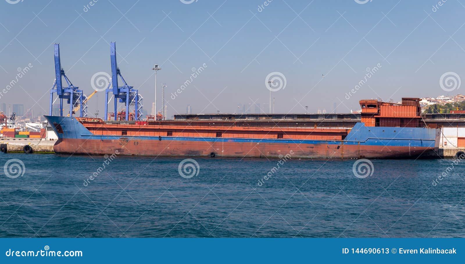 Cargo Ship in Port editorial stock photo. Image of freighter - 144690613