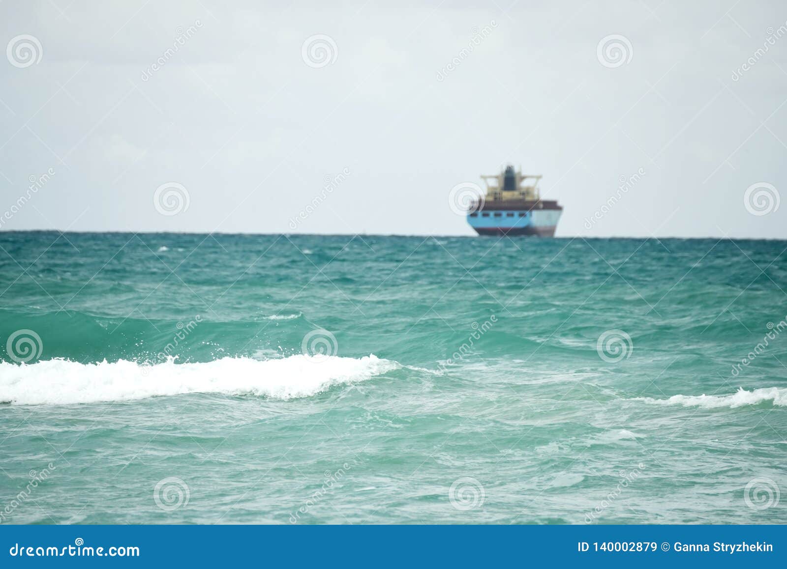 A Cargo Ship Standing Far in the Ocean on the Horizon. Stock Image ...