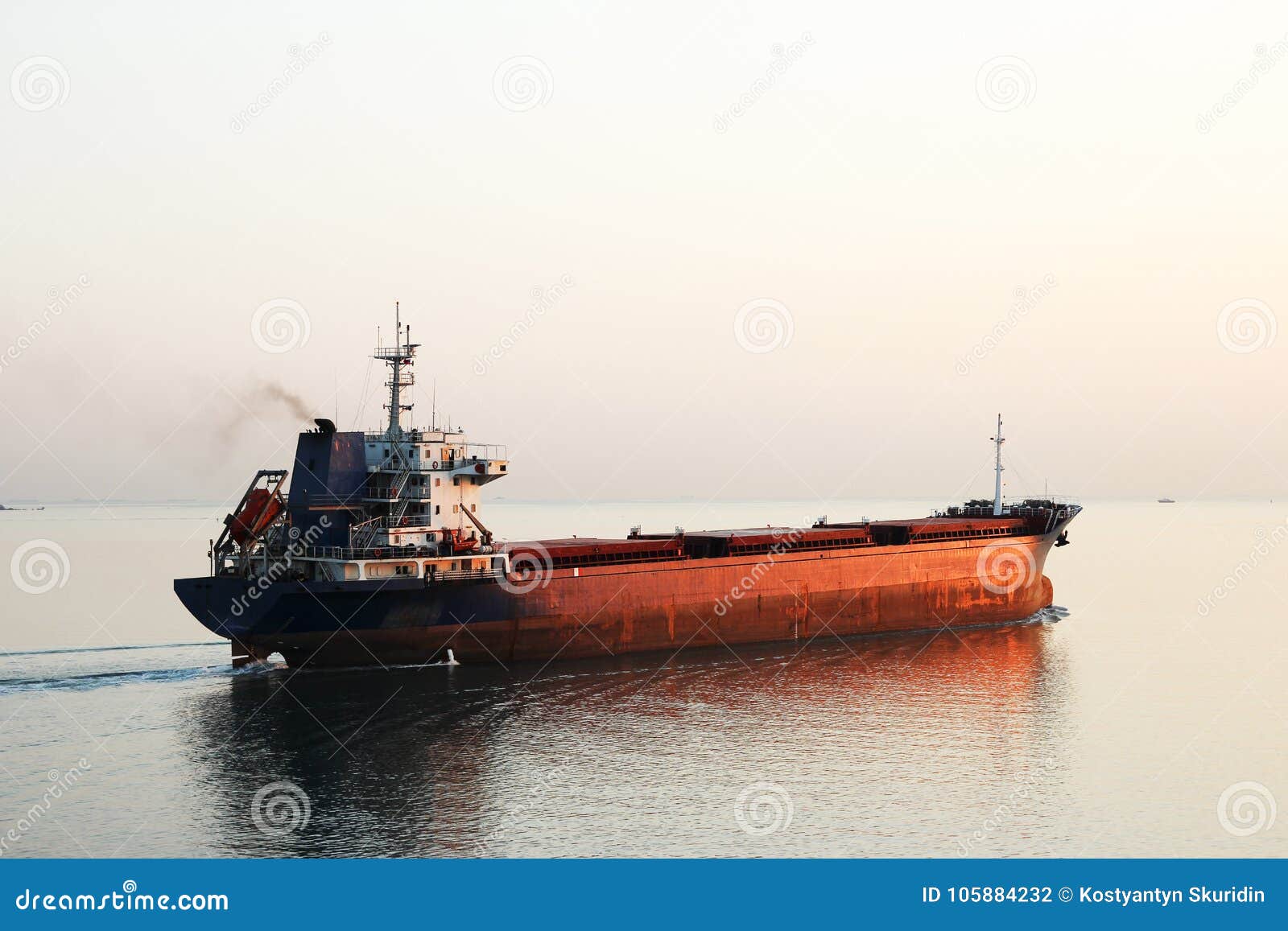 Cargo Ship Straight To Dawn Horizon Stock Photo - Image of cargo ...