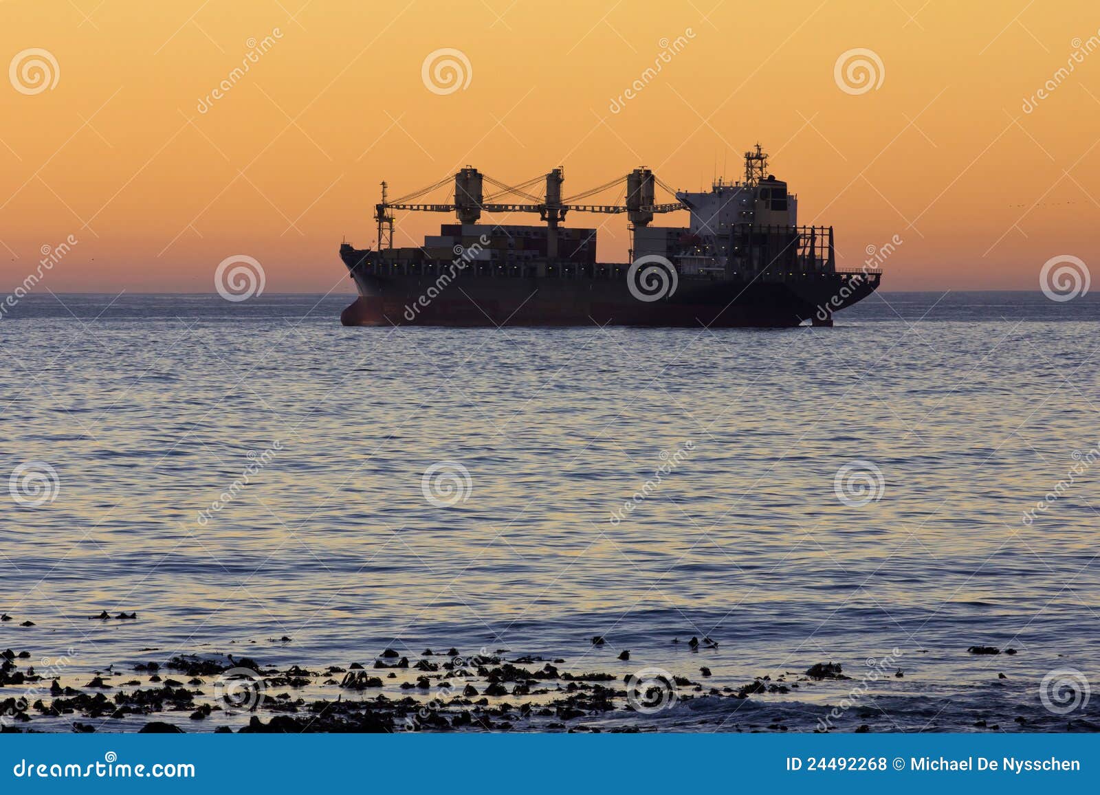 Cargo ship at sunset stock photo. Image of dusk, carrying - 24492268