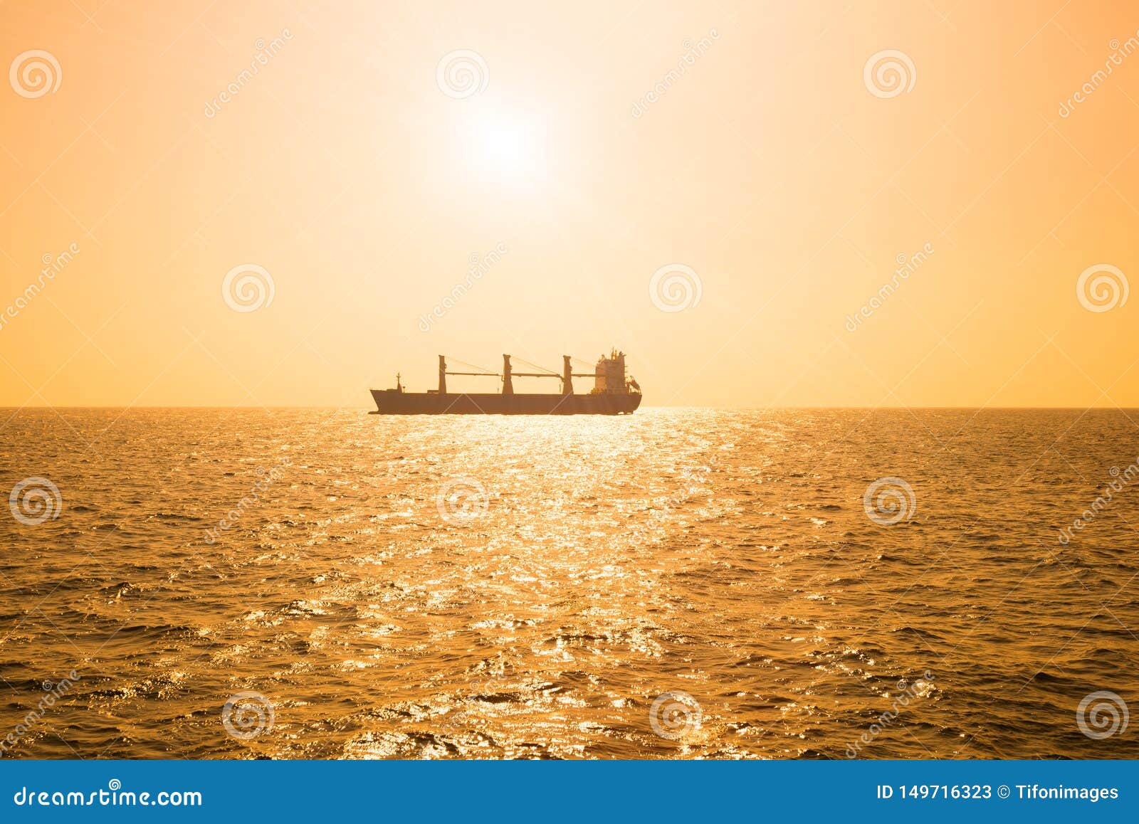 A cargo ship at sunset stock image. Image of chilean - 149716323