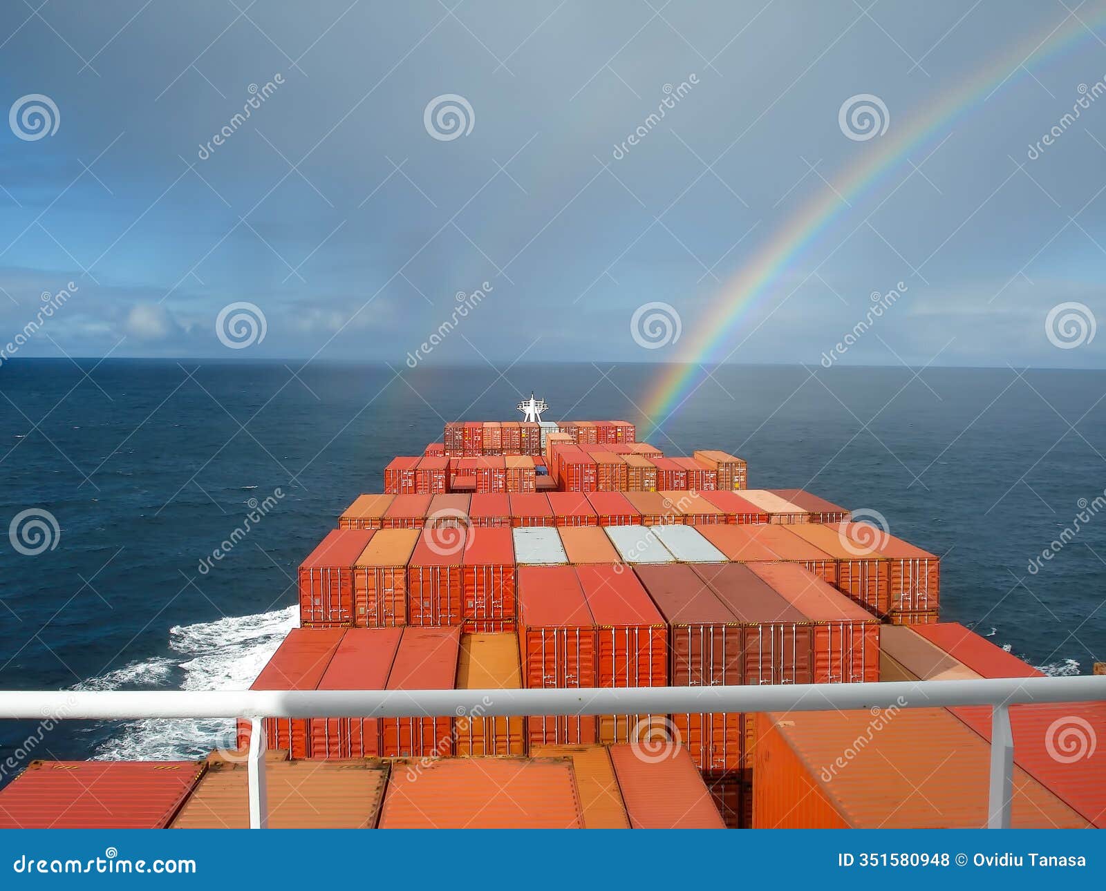 Cargo Ship with Transporting Containers Over the Ocean with Rainbow on ...