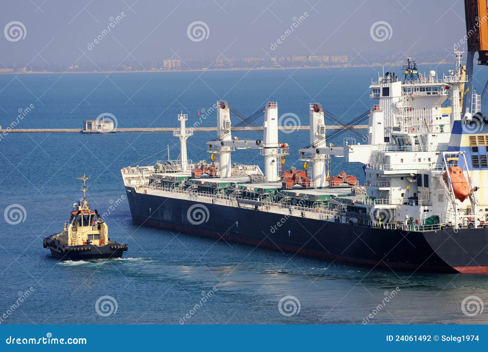 Cargo ship and tug stock photo. Image of port, maritime - 24061492