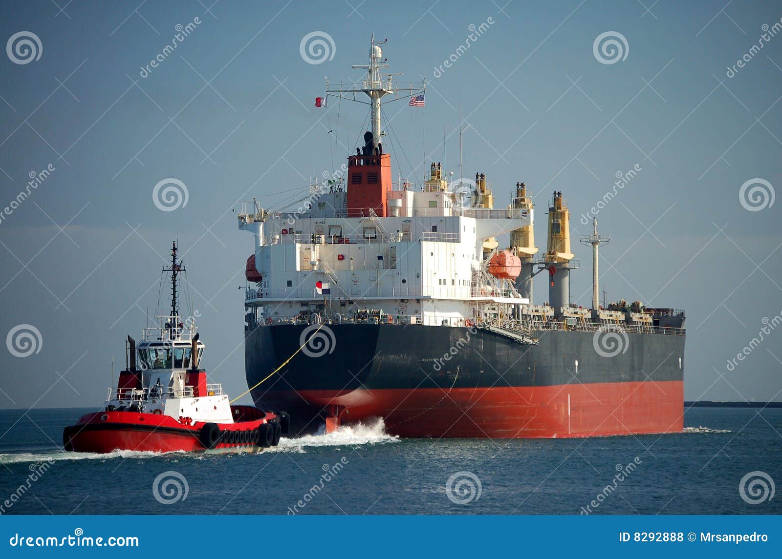 Cargo Ship with Tug stock photo. Image of navigate, pedro - 8292888