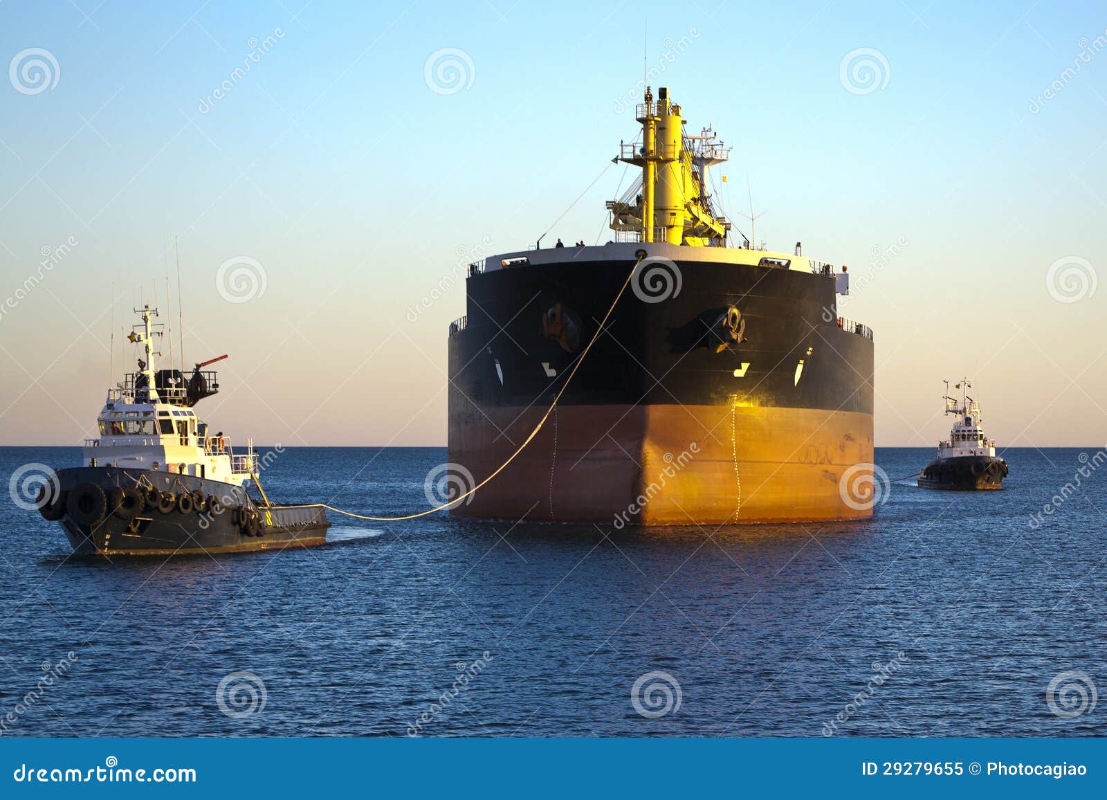 Cargo Ship with Two Tug Boats Assistance Stock Image - Image of freight ...
