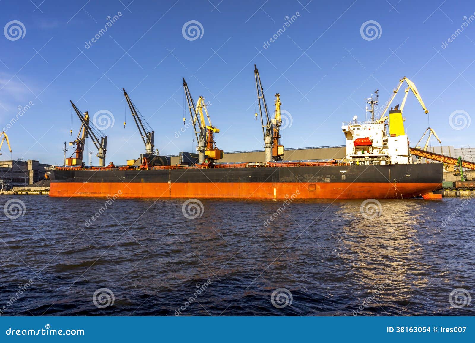 Cargo ship unloading stock photo. Image of embarkment - 38163054