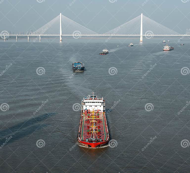 Cargo Ships Under a Cable-stayed Bridge Stock Image - Image of ...