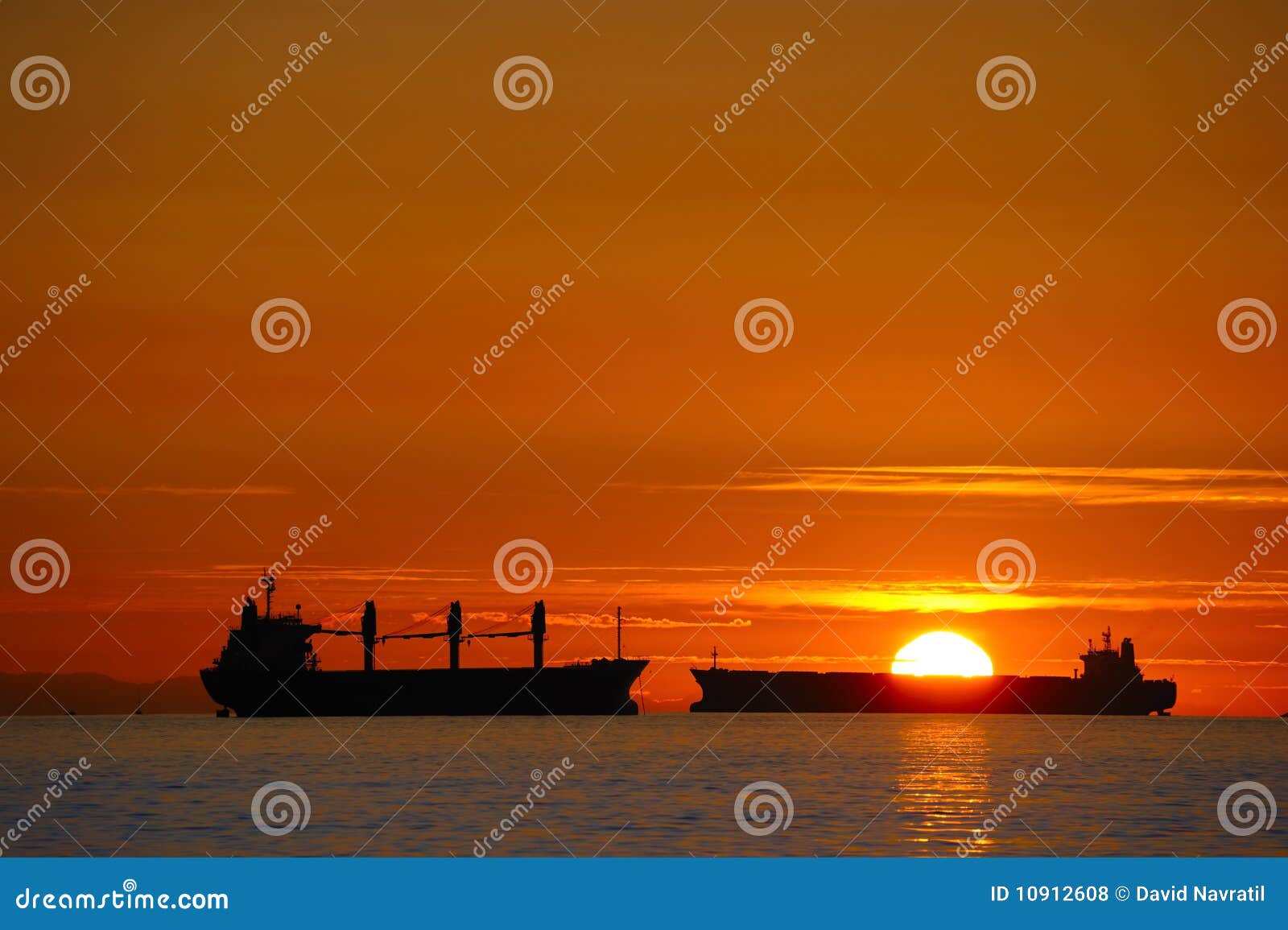 Cargo ships at sunset stock photo. Image of shipping - 10912608