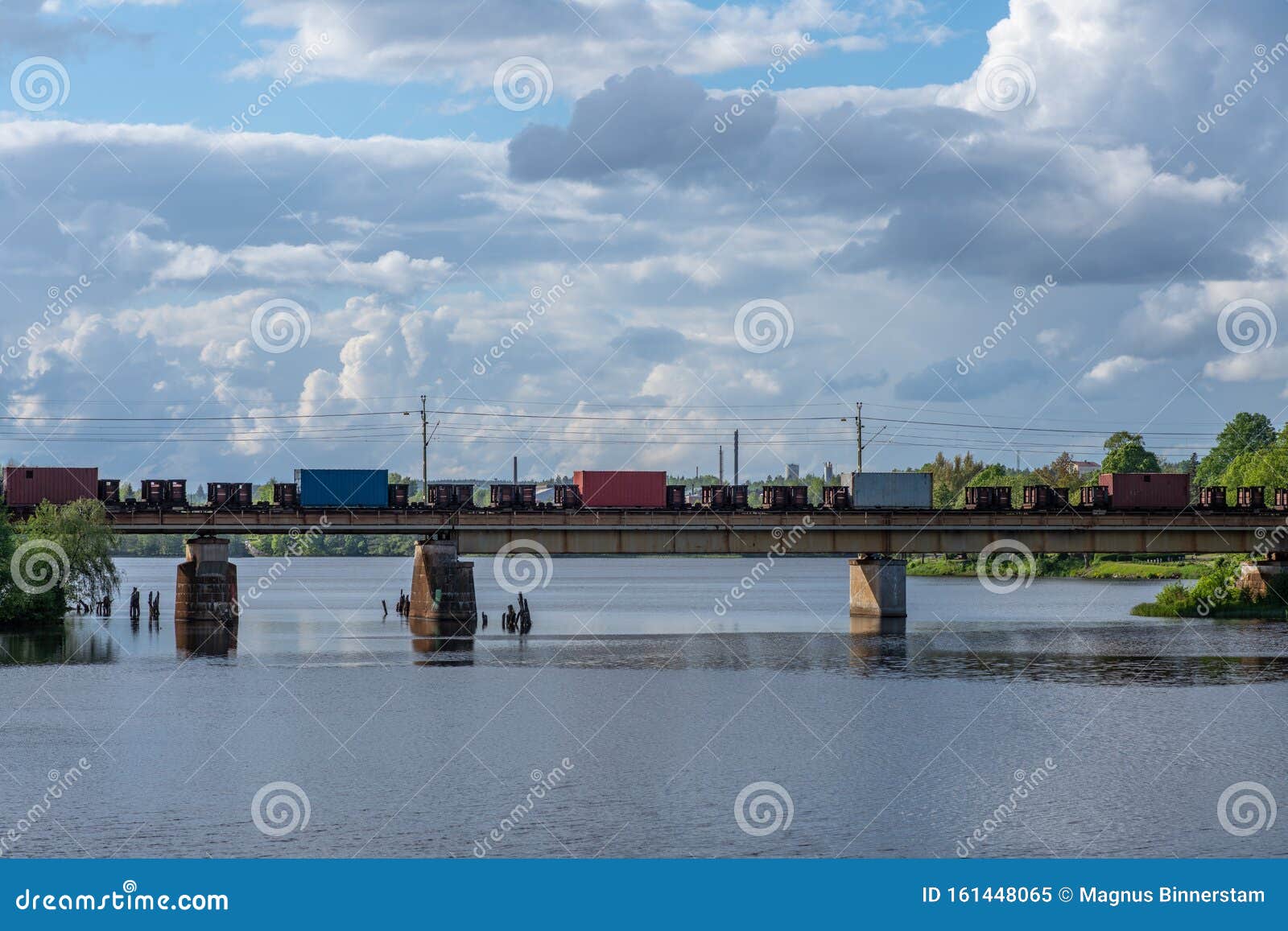 Cargo Train Crossing a Bridge Over Water Stock Image - Image of bridge ...