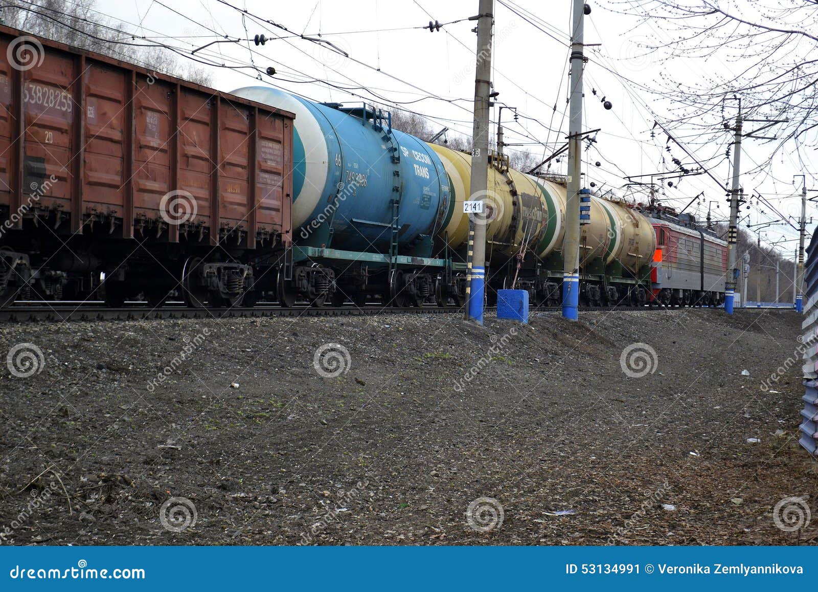 The Cargo Train with Tanks Moves on Railway Tracks. Editorial Photo ...