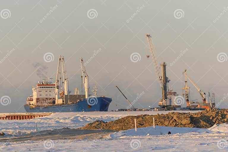 Cargo Vessel Moored in Arctic Port. Winter Time. Ice Navigation Stock ...