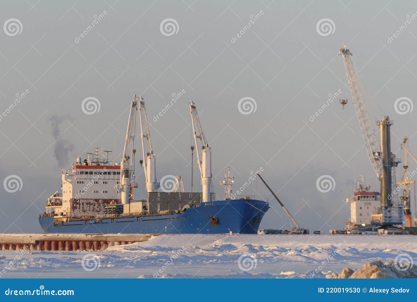 Cargo Vessel Moored in Arctic Port. Winter Time. Ice Navigation Stock ...