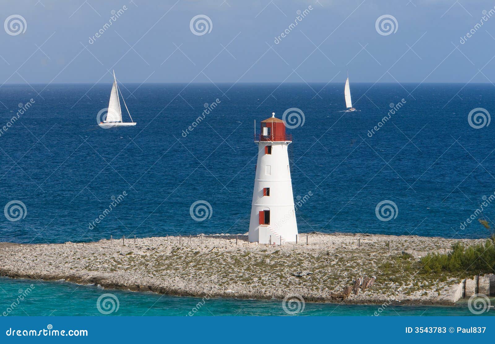Caribbean Lighthouse with Sail Stock Image - Image of ocean, boat: 3543783