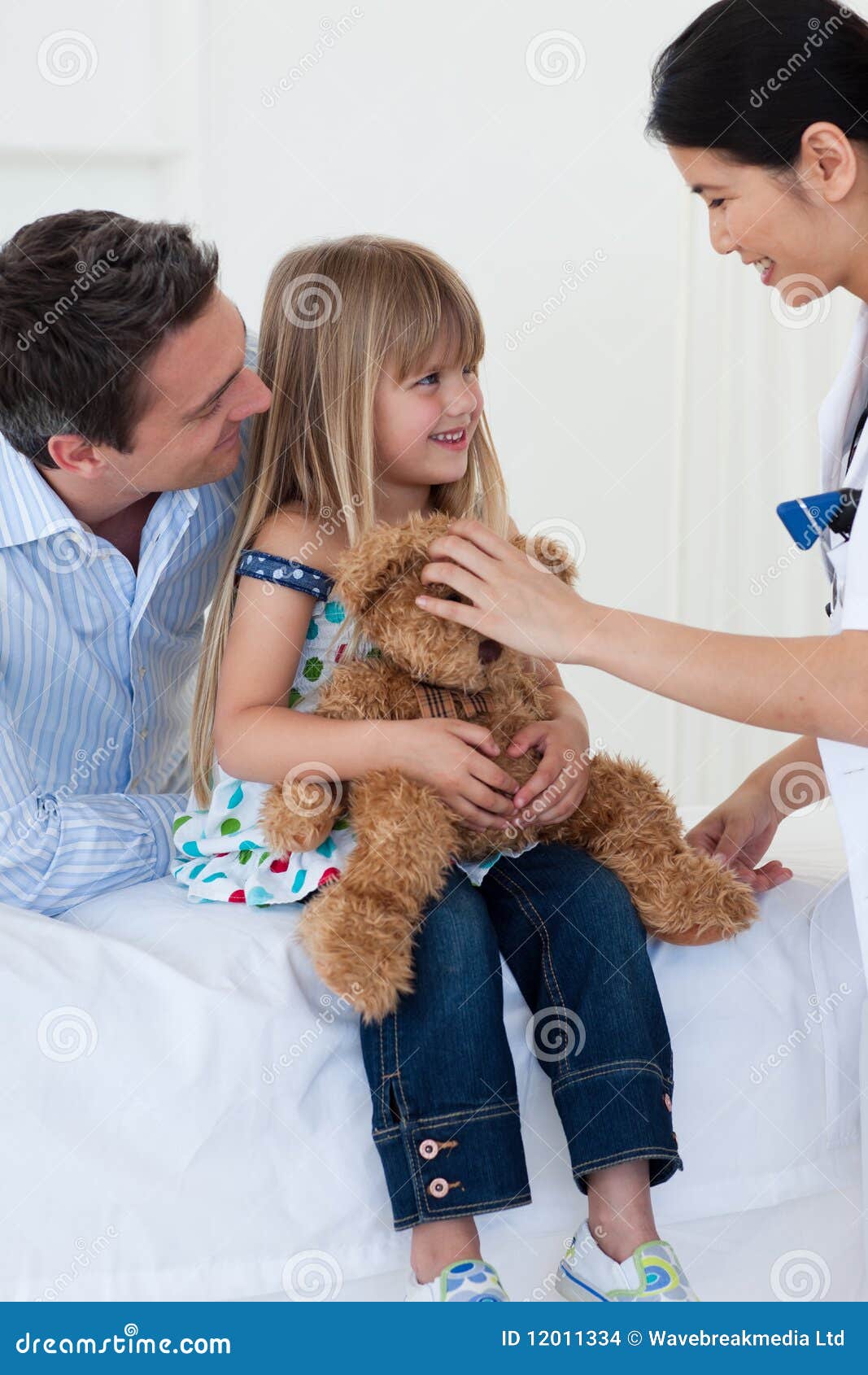 Caring Doctor Playing with a Child Patient Stock Photo - Image of ...