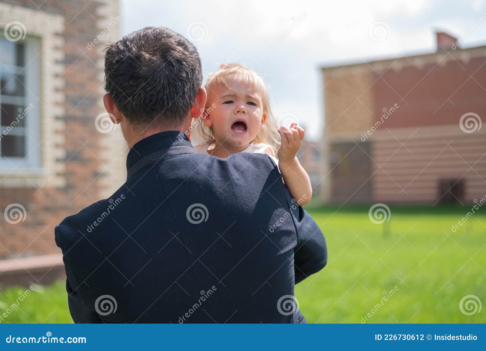 Caring Father Holds on Hands of His Little Daughter Outdoors. Stock ...