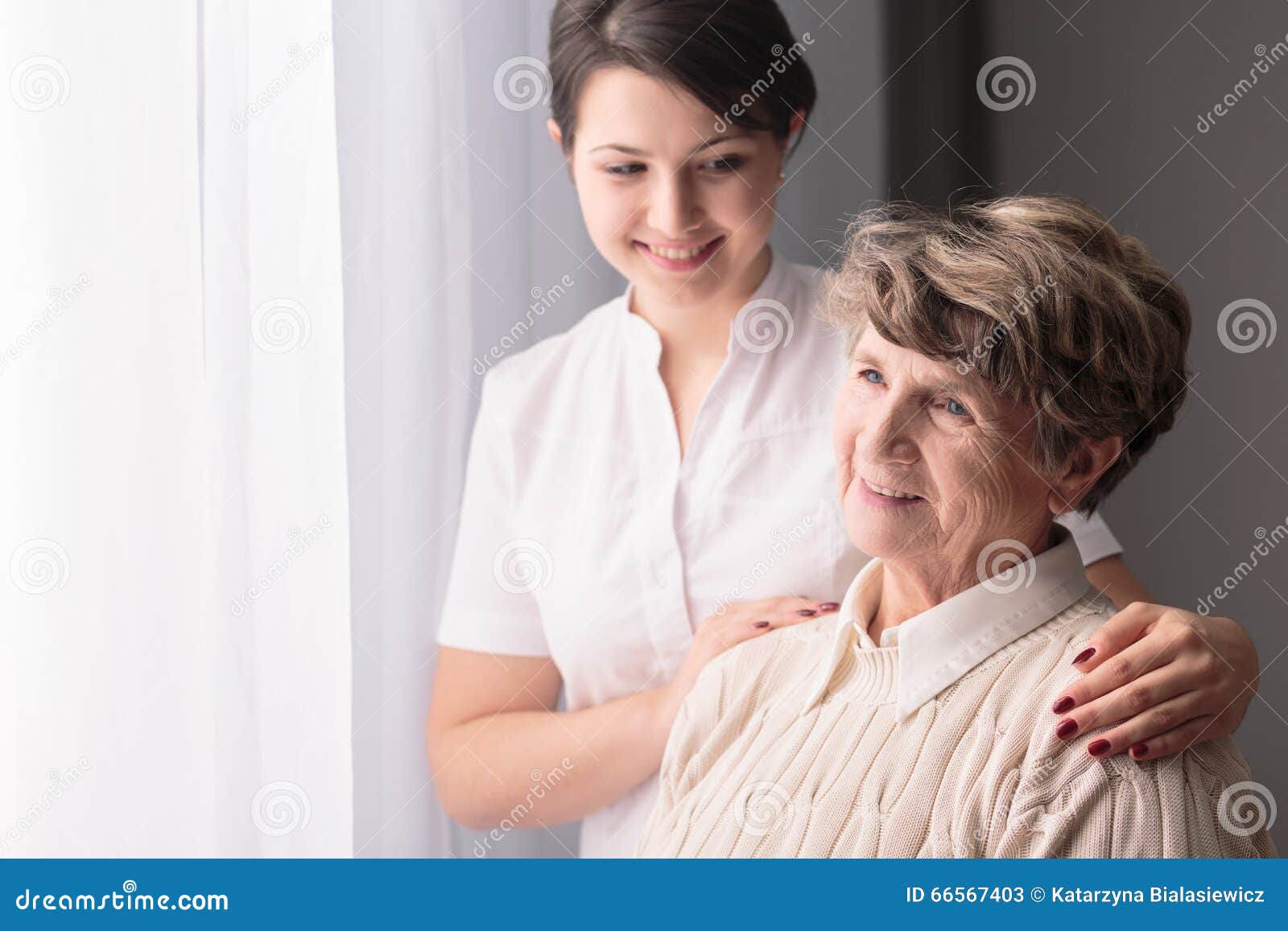 Caring lovely caregiver stock image. Image of smile, young - 66567403