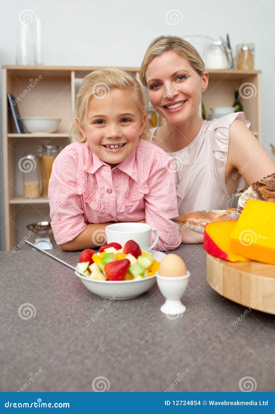 Caring Mother Eating Fruit with Her Daughter Stock Photo - Image of ...