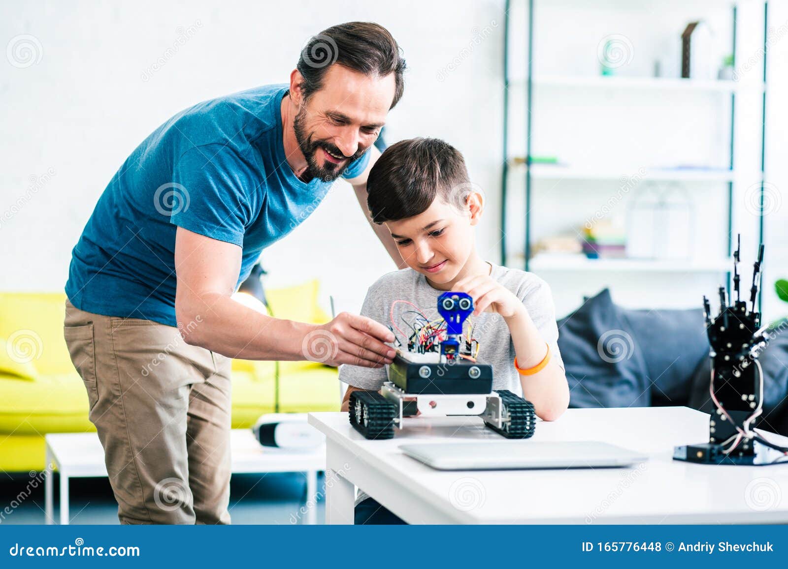 Caring Smiling Father Helping His Son with Engineering Stock Photo ...