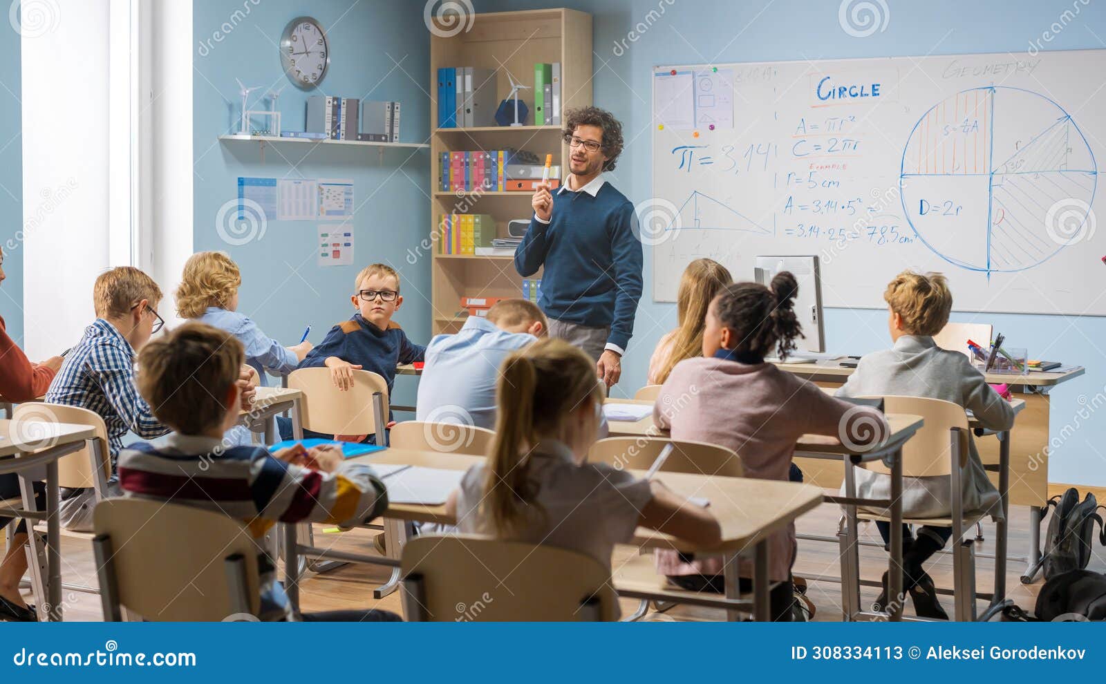 Caring Teacher Explains Lesson To a Classroom Full of Bright Diverse ...