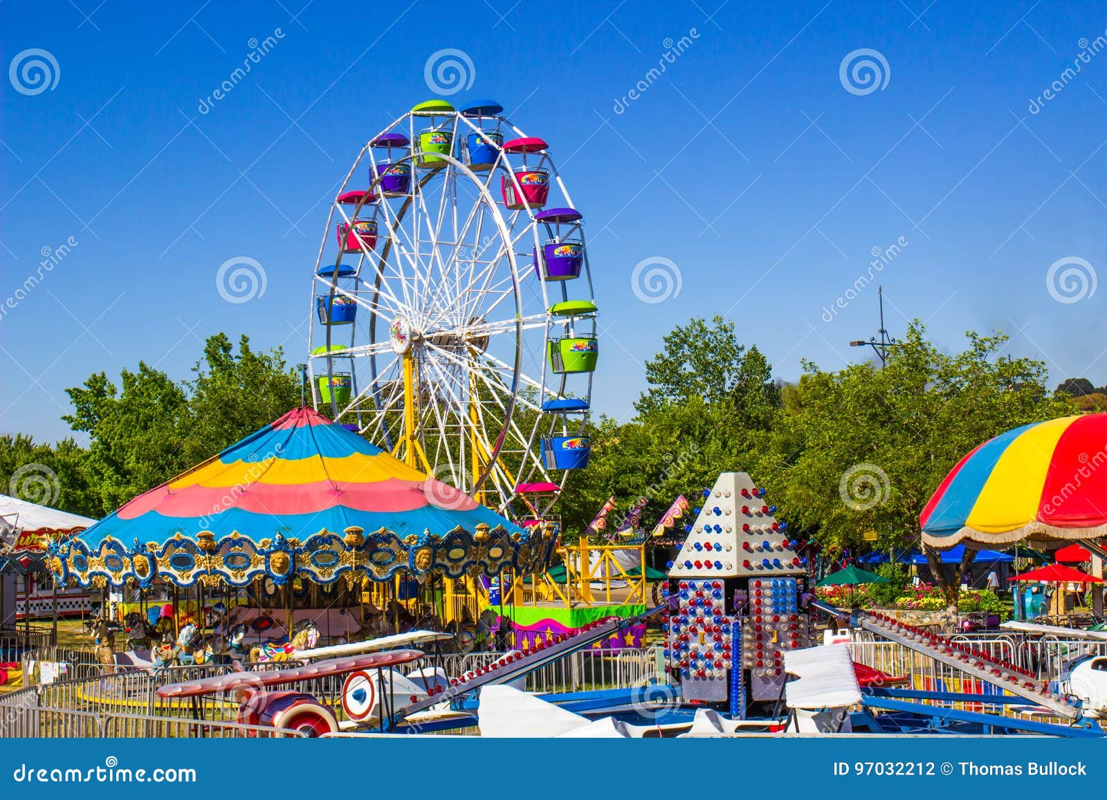 Carnival Rides at Small County Fair Stock Photo - Image of umbrellas ...