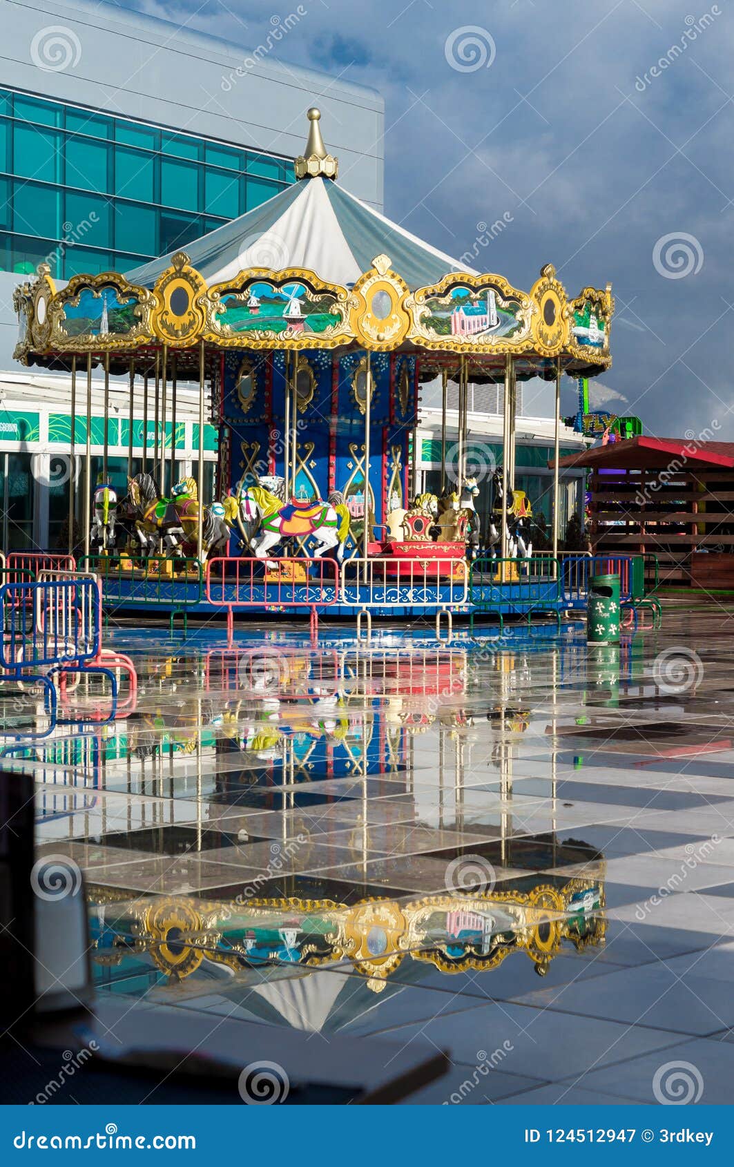 Carousel on a Cloudy Day with Reflection Stock Image - Image of ...