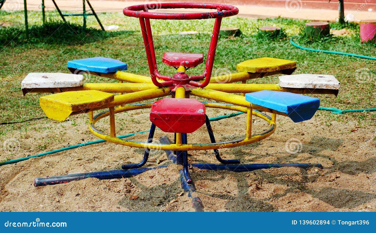 Carousel in the playground stock photo. Image of morning - 139602894