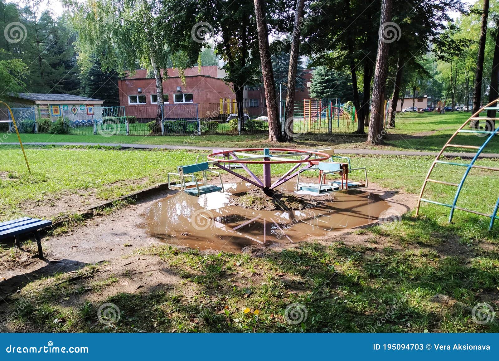 Carousel on the Playground in a Puddle Stock Image - Image of rotation ...