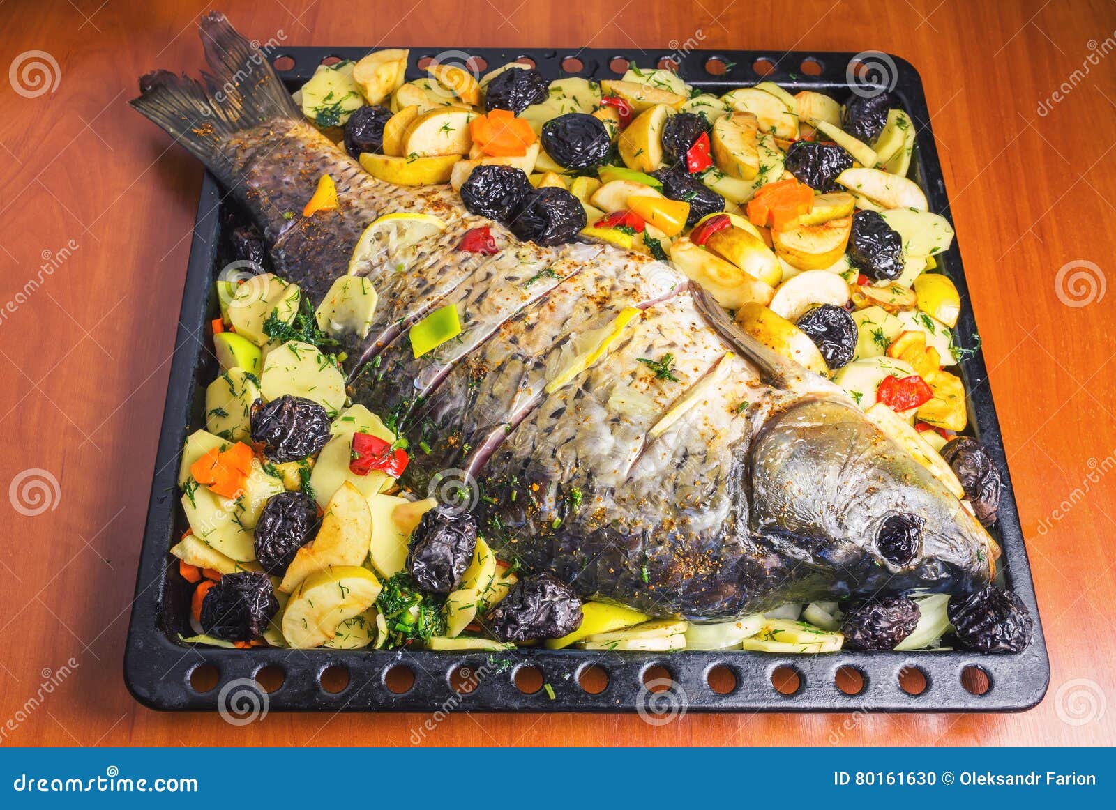 Carp Fish Prepared for Cooking in Baking Dish with Vegetables. Stock ...
