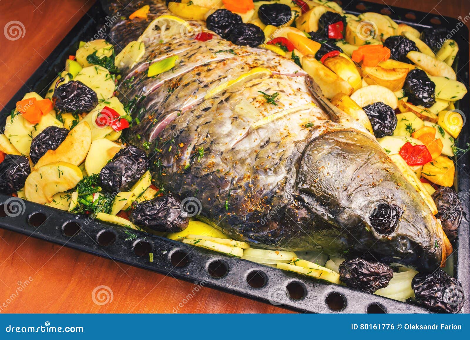 Carp Fish Prepared for Cooking in Baking Dish with Vegetables. Stock ...