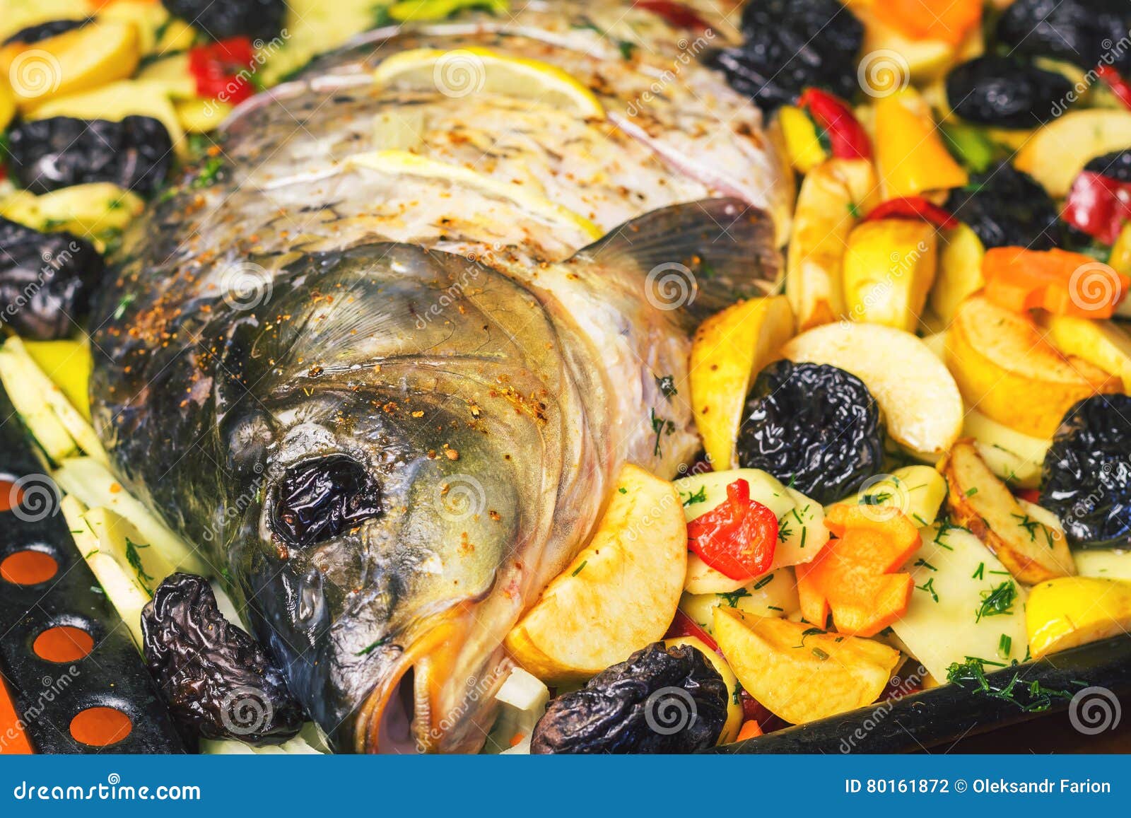 Carp Fish Prepared for Cooking in Baking Dish with Vegetables. Stock ...