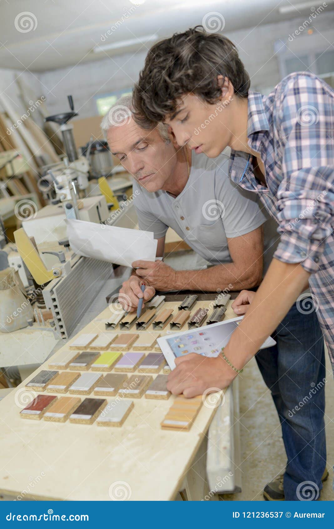 Carpenter and Apprentice Looking at Wood Samples Stock Image - Image of ...