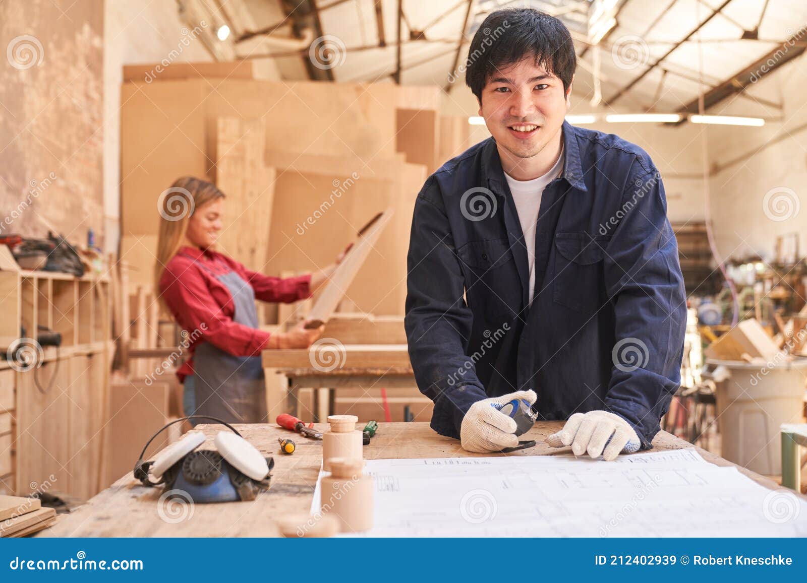 Carpenter Apprentice in Training with Construction Plan Stock Image ...