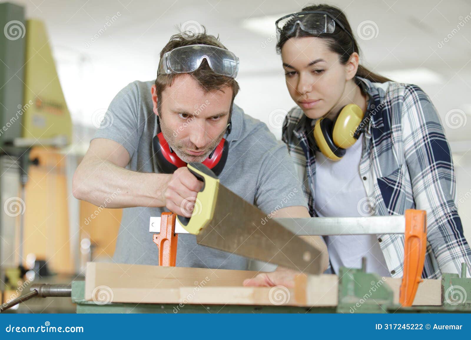 Carpenter and Apprentice Working Together in Wood Workshop Stock Photo ...