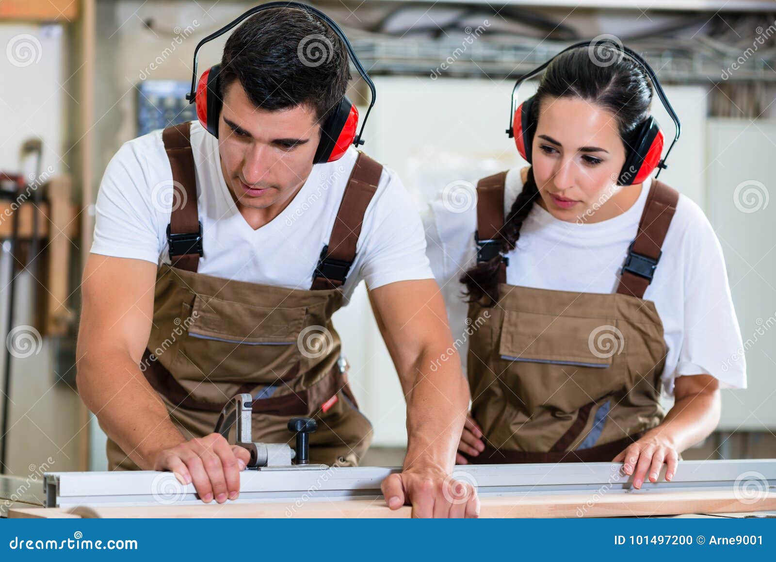 Carpenter and Apprentice Working Together in Workshop Stock Photo ...